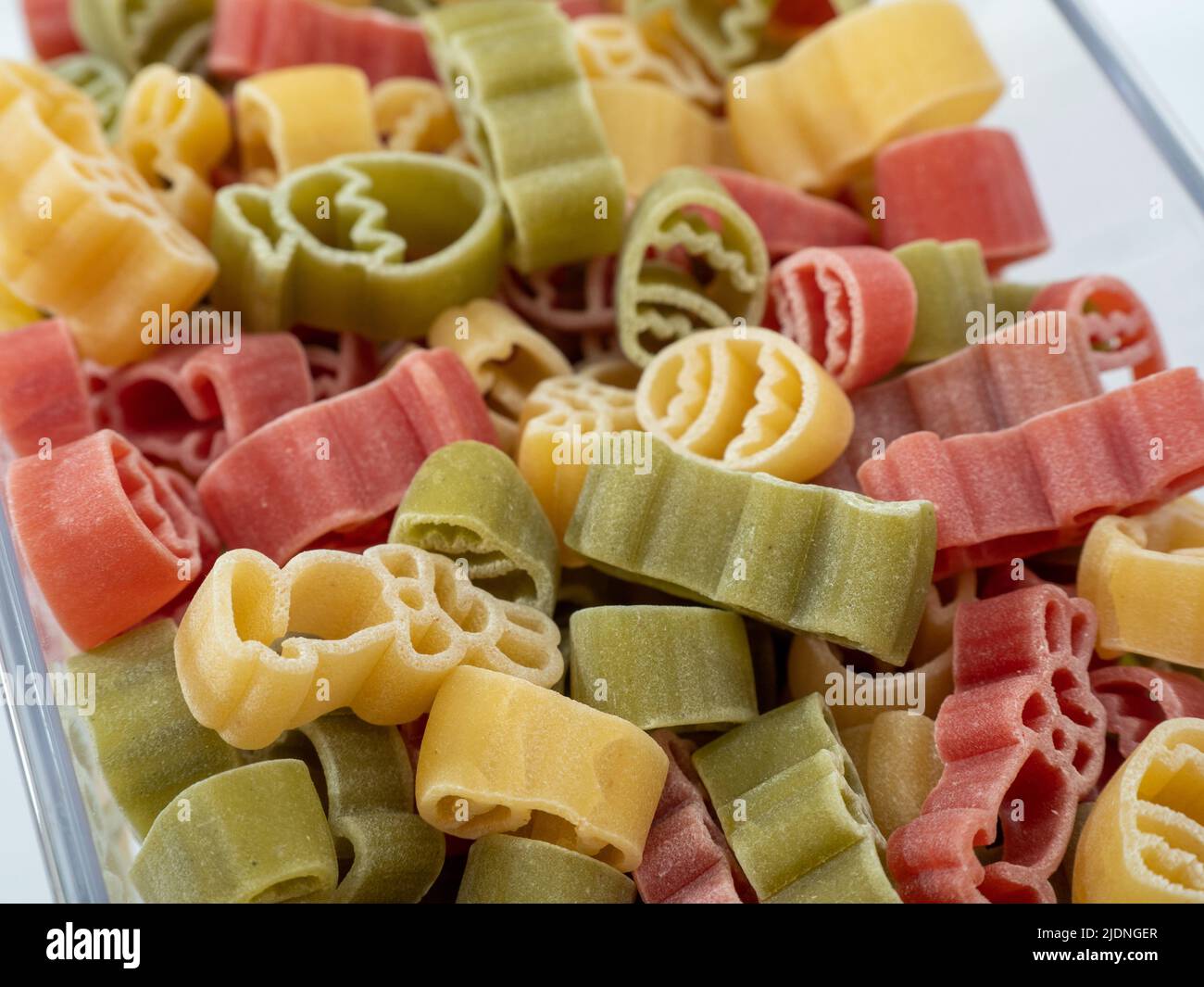 Raw pasta. Vermicelli in different colors. Pasta on a white background ...