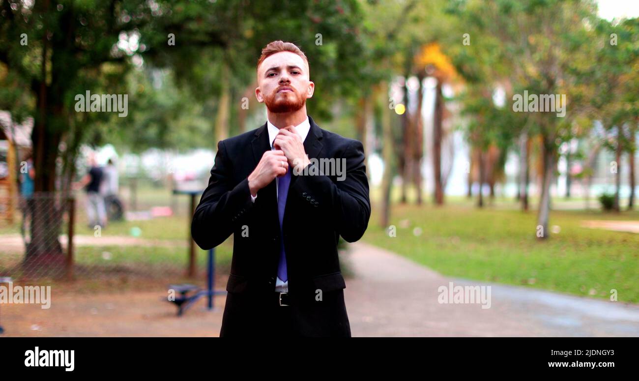 Angry business man standing arguing to camera outside. Upset executive ...