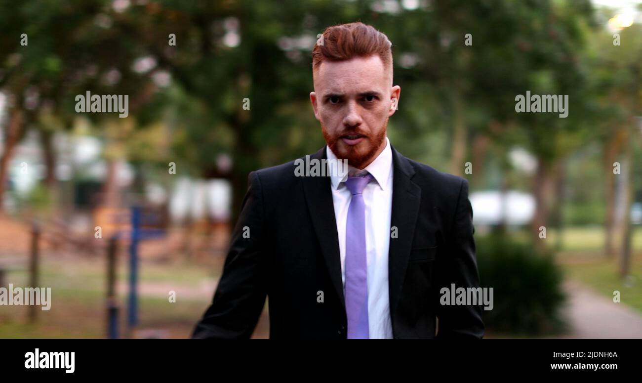 Frustrated businessman standing outside corporate hi-res stock ...
