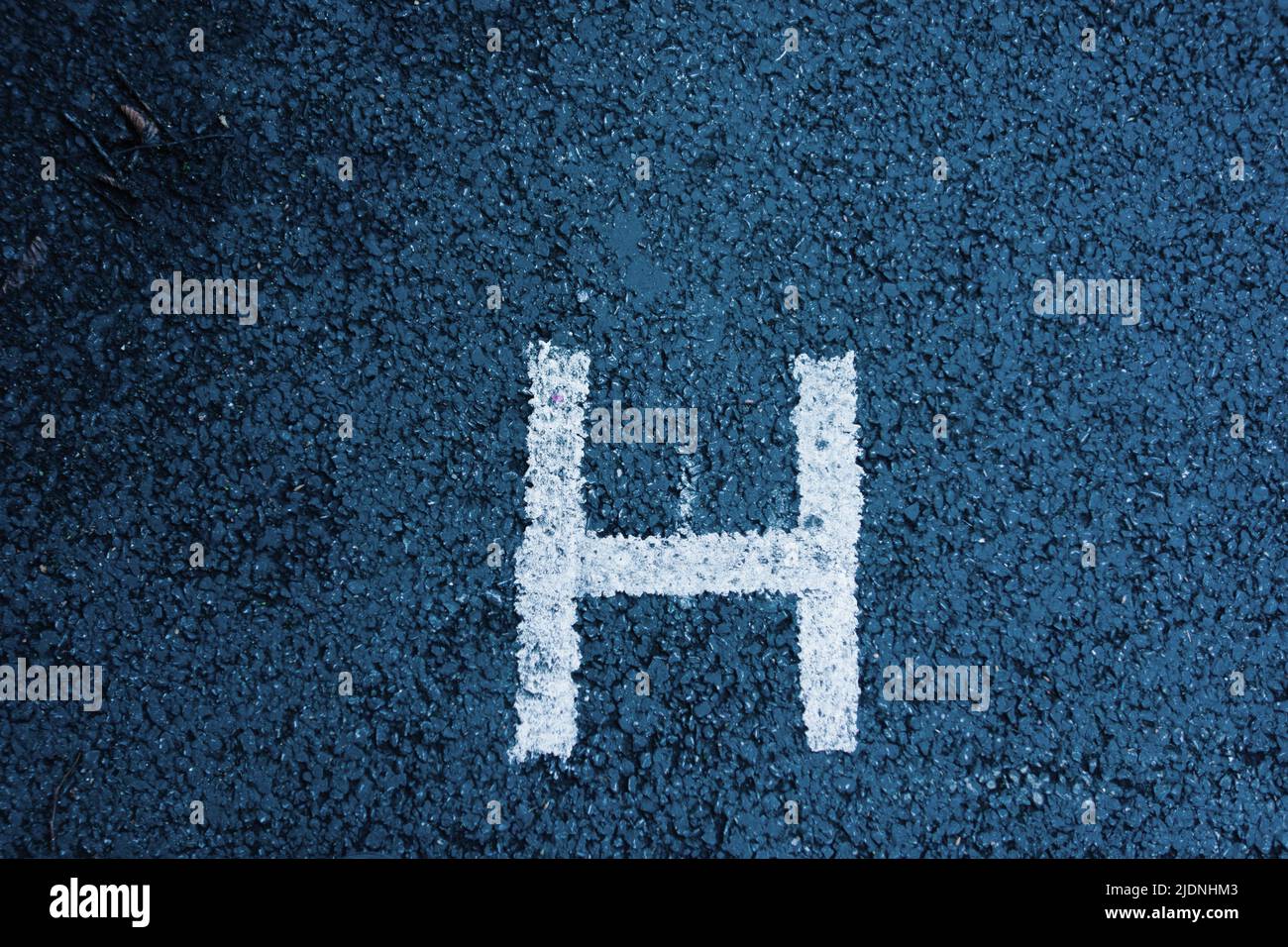 letter H painted on tarmac of a parking bay Stock Photo - Alamy