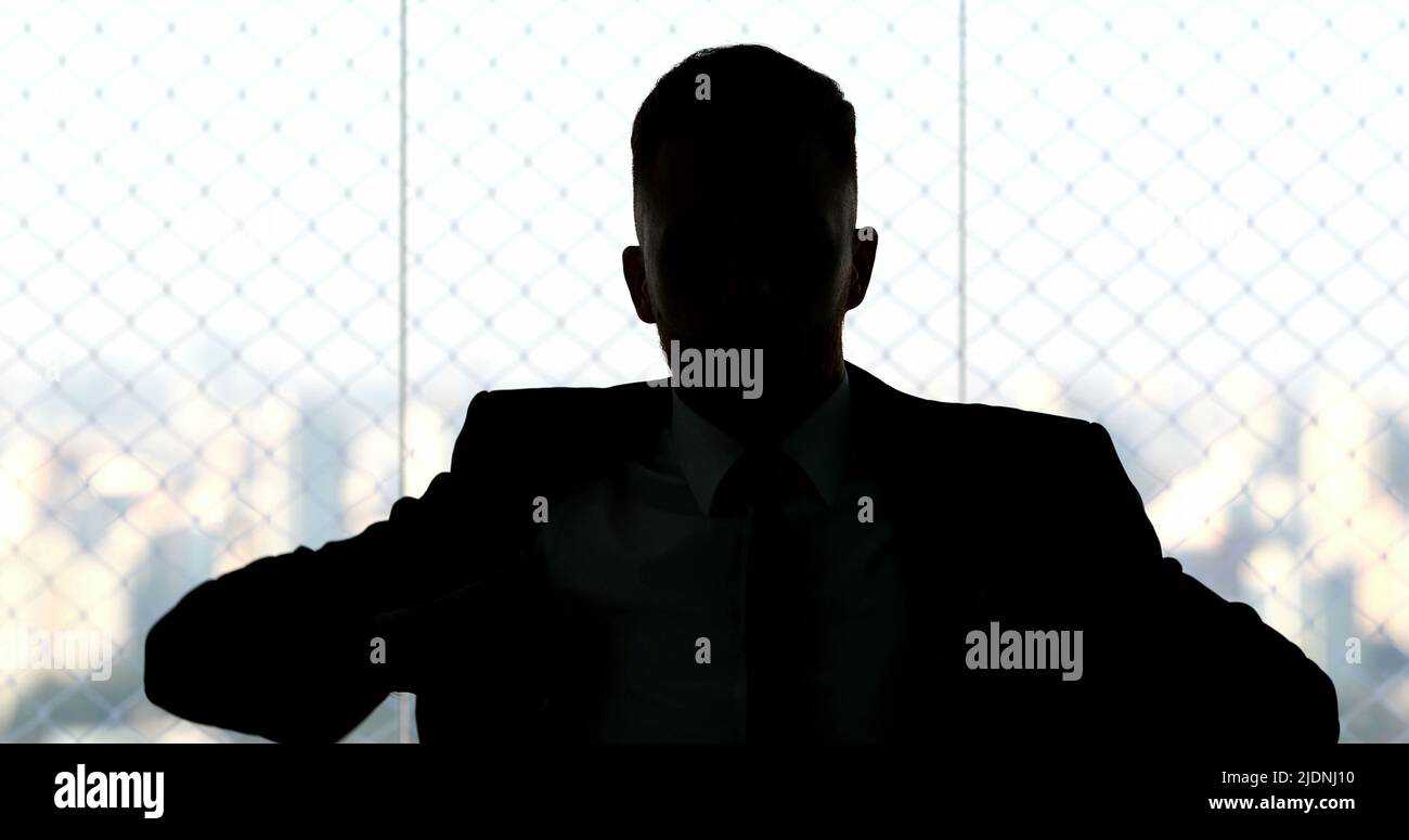 Business man put suit on during morning routine at home, preparing to ...
