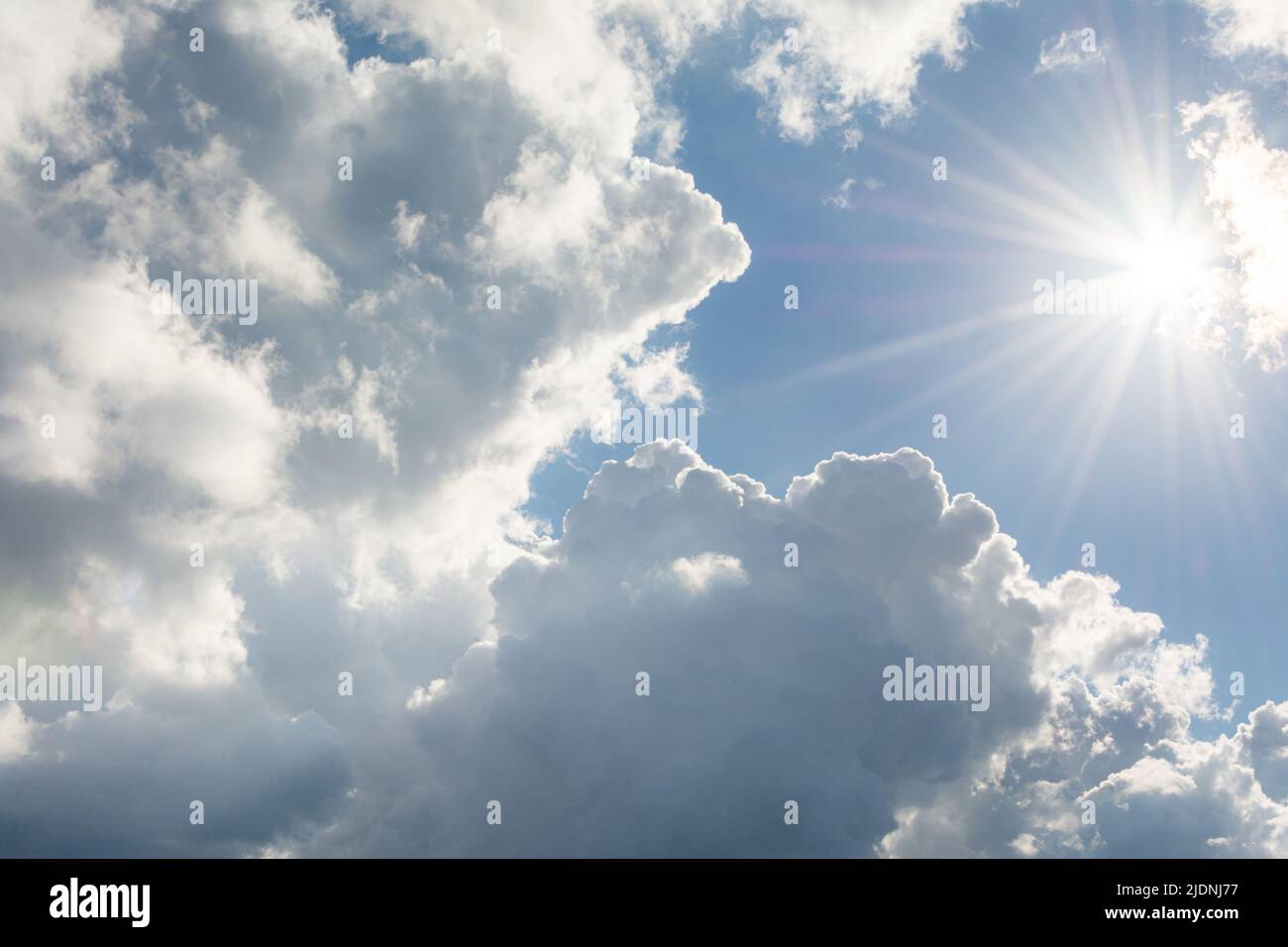 Sun from the front, in a clear cloudy sky Stock Photo - Alamy