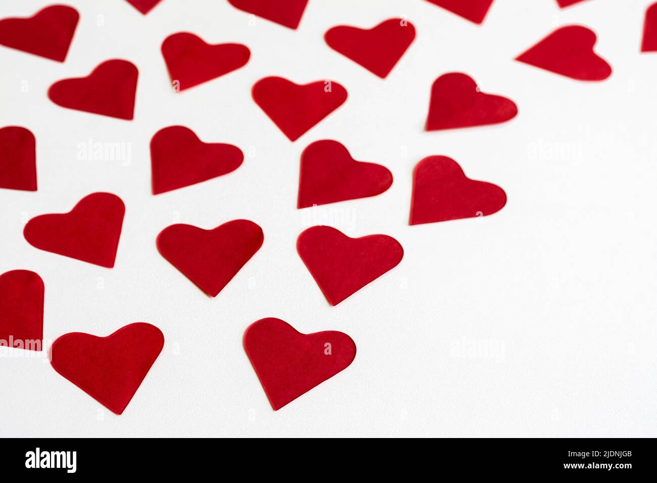 Paper red hearts on white background Stock Photo - Alamy