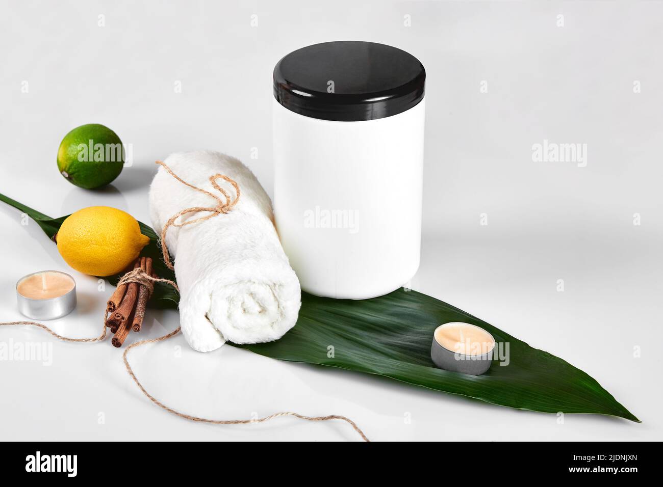 Skin care beauty treatment with jar of body moisturizer. White body ...