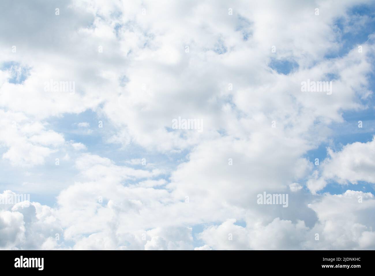 Very cloudy blue sky Stock Photo - Alamy