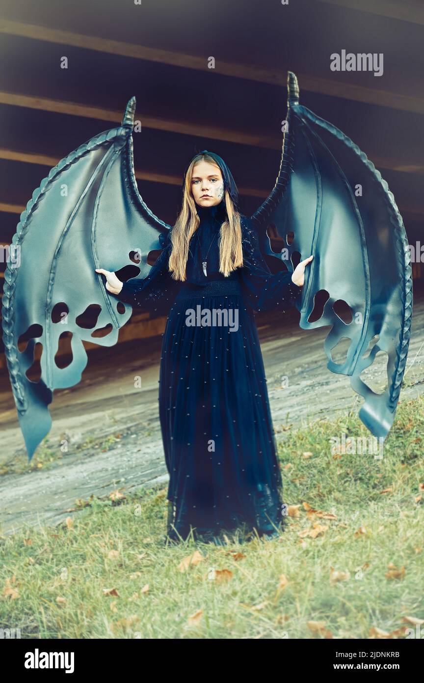 portrait of a little girl with bat wings. halloween concept Stock Photo ...