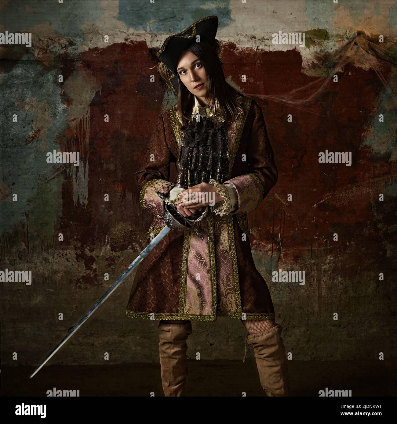 retro portrait of a musketeer girl in a hat with a sword Stock Photo ...