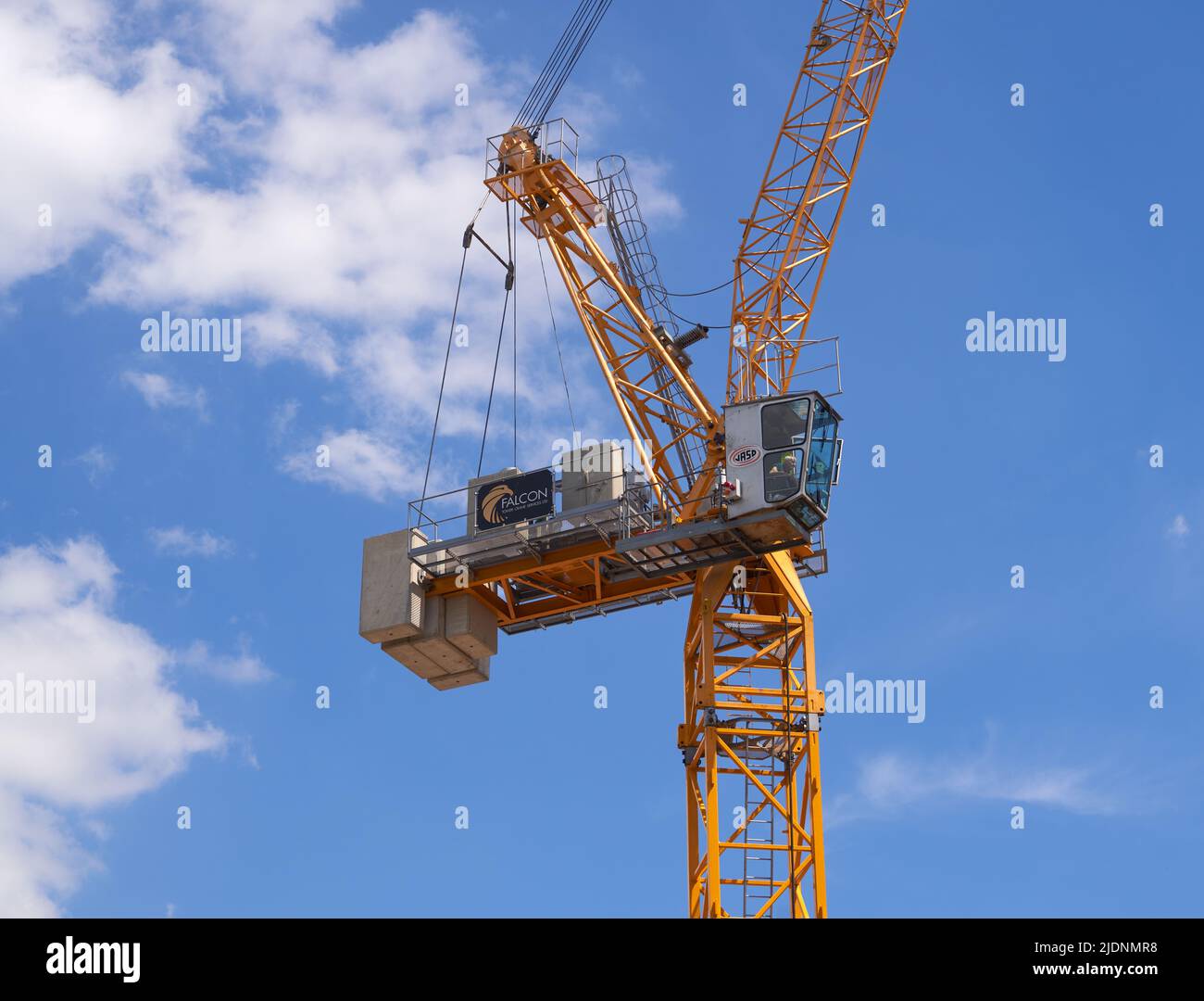 Operators cab of a yellow tower crane Stock Photo - Alamy