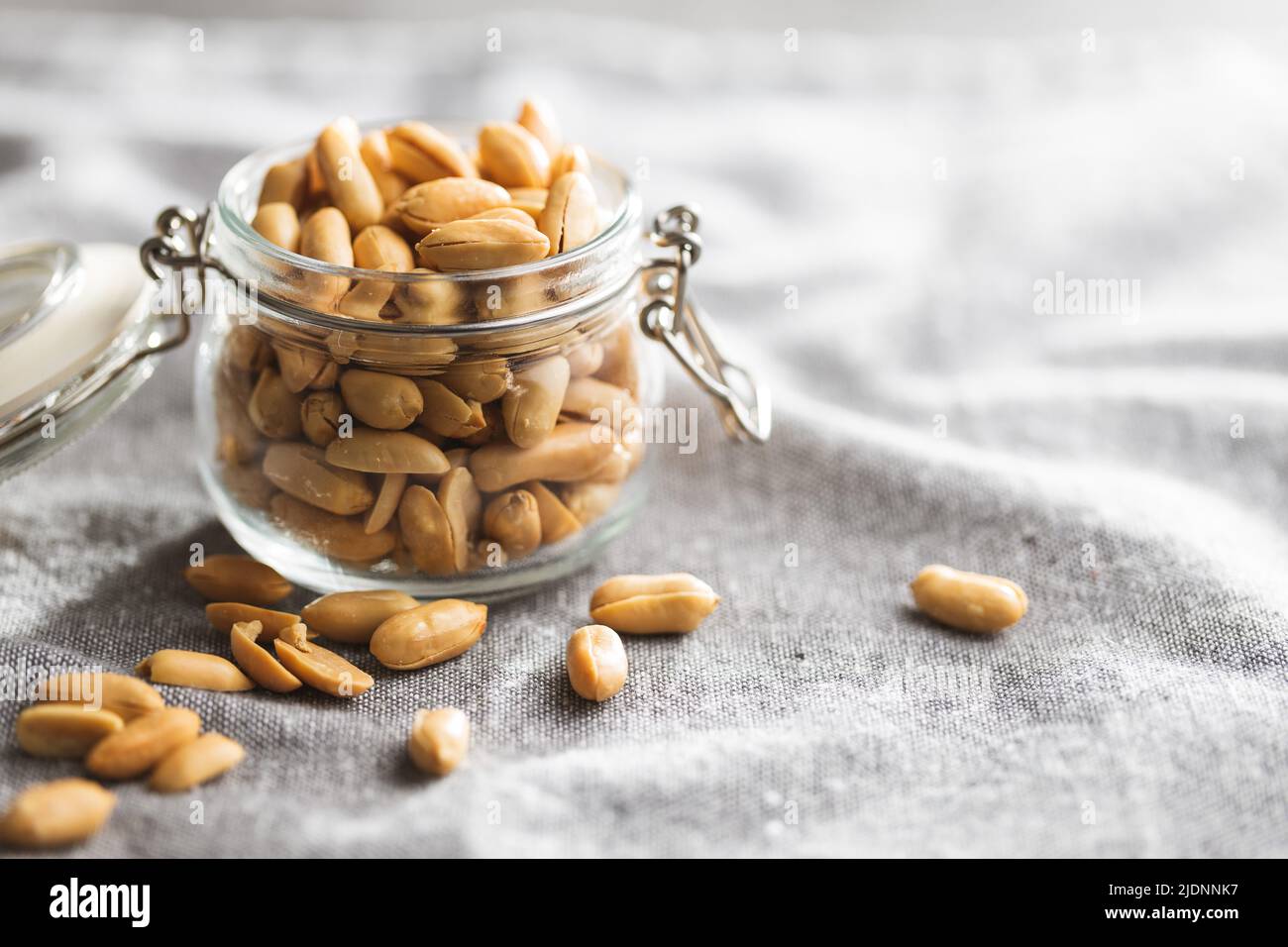 Roasted peeled peanuts in a jar Stock Photo - Alamy