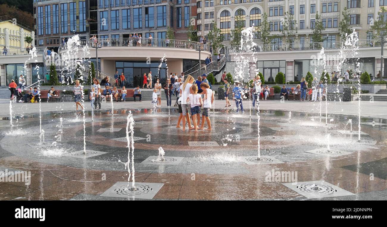 Kiev, Ukraine August 25, 2017: Children play with a fountain and with ...