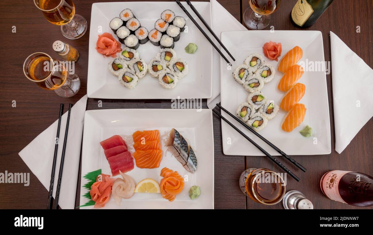 Plates of sushi on a table in a Japanese restaurant Stock Photo - Alamy