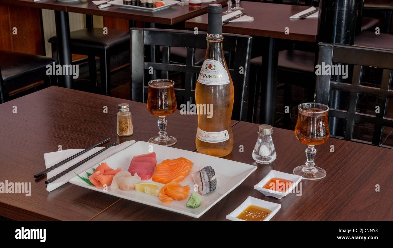 Assorted sushi plate on a table in a Japanese restaurant Stock Photo ...