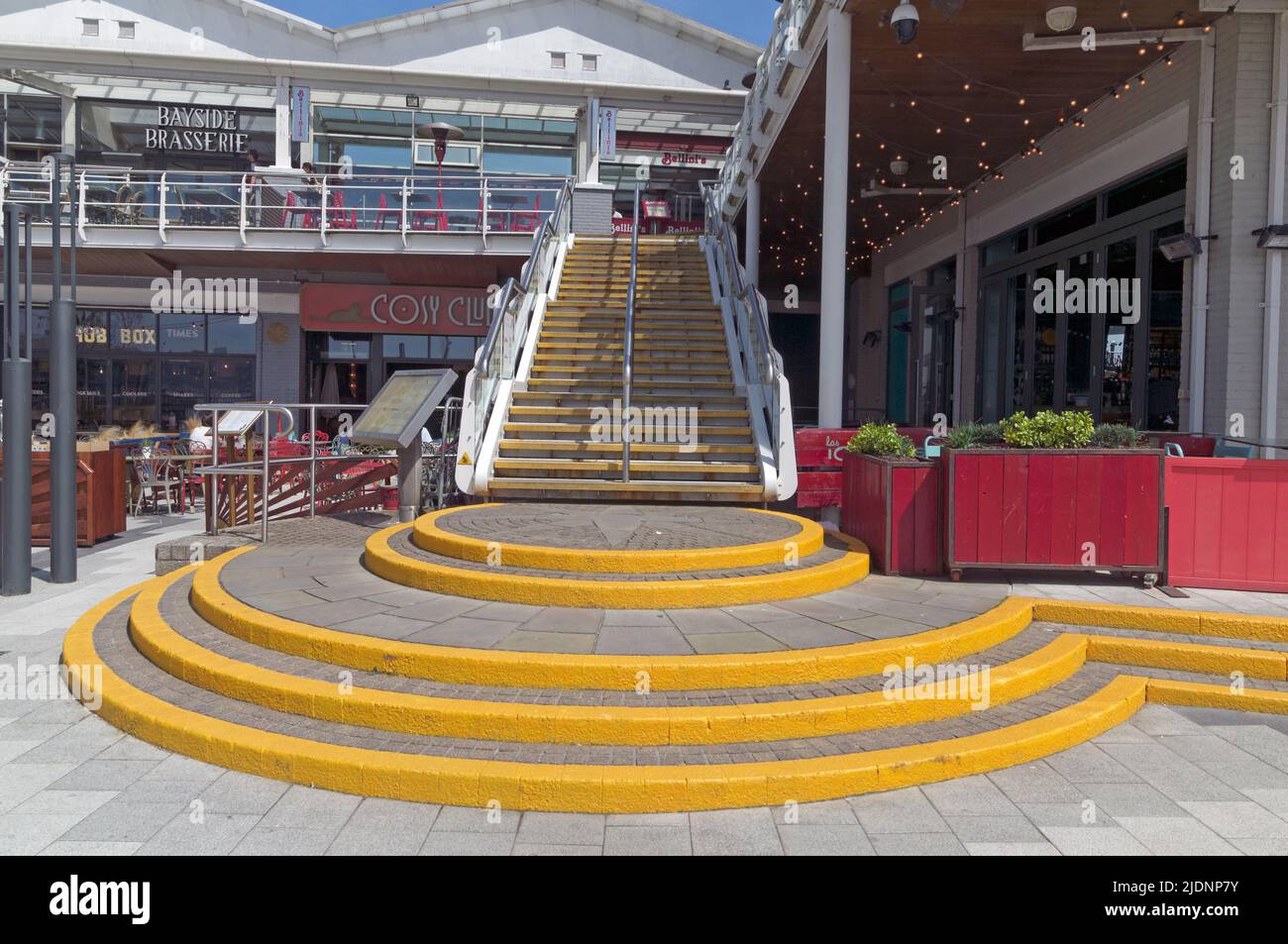 Eye catching yellow painted steps, Cardiff Bay Stock Photo - Alamy