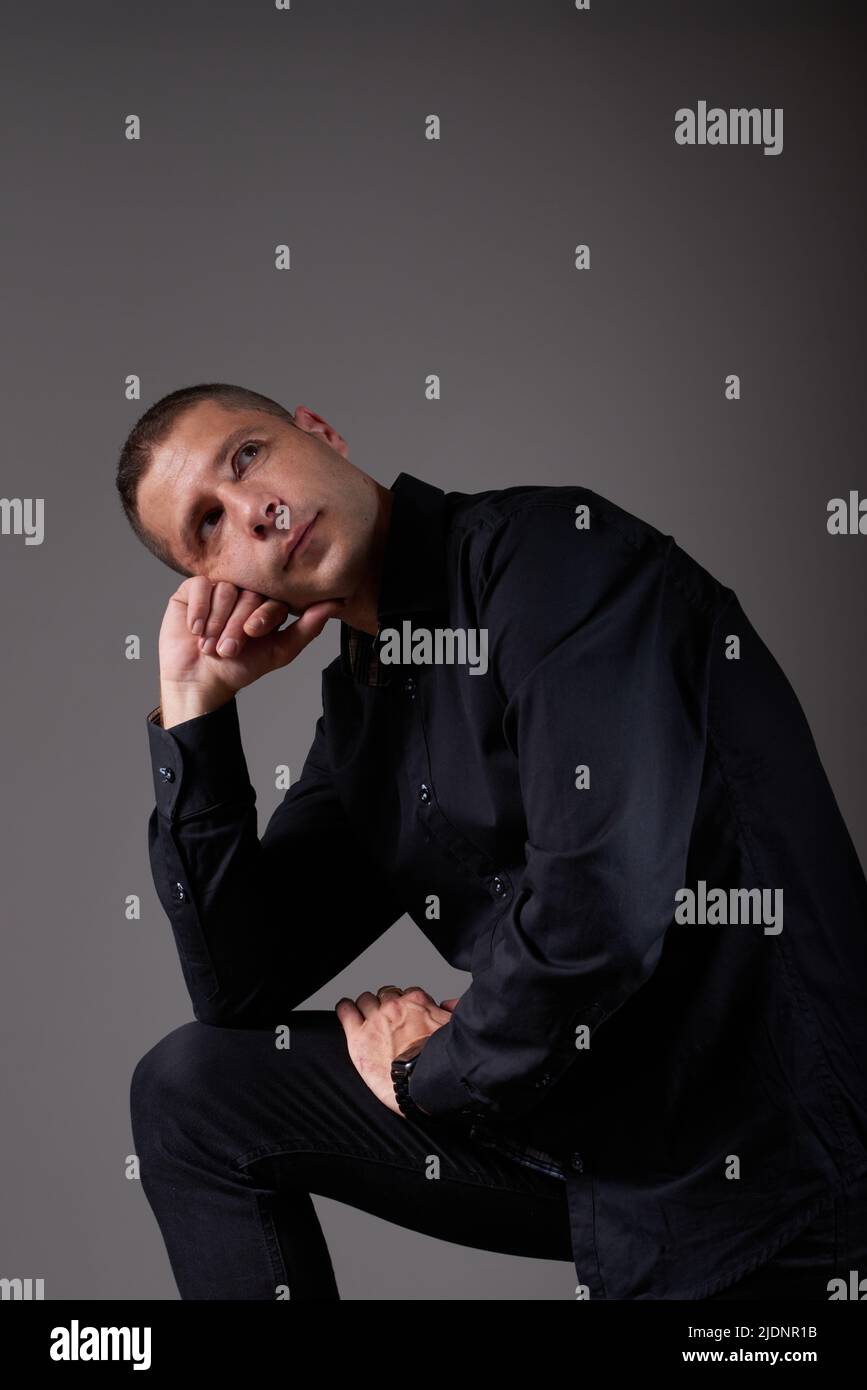 Stylish young man standing chair hi-res stock photography and images ...