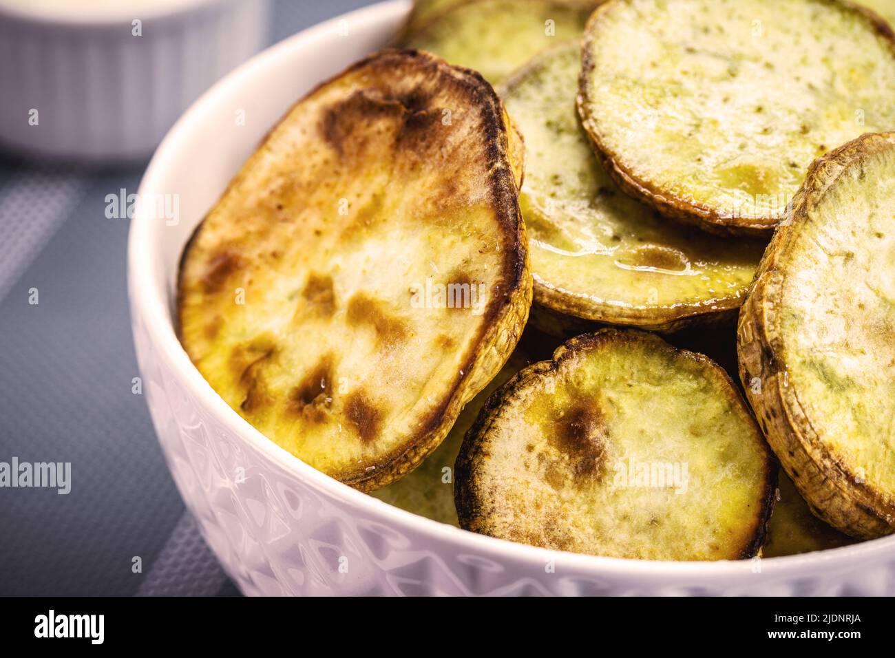 Pot of fried or baked sweet potatoes, sliced and served hot, typical ...