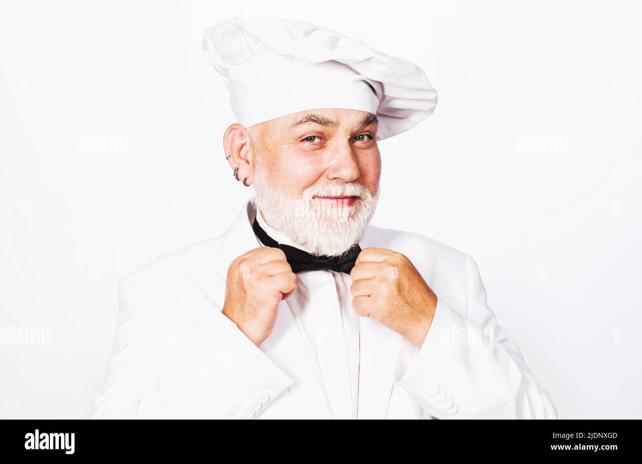 Smiling bearded chef in white uniform and hat. Kitchen advertising ...