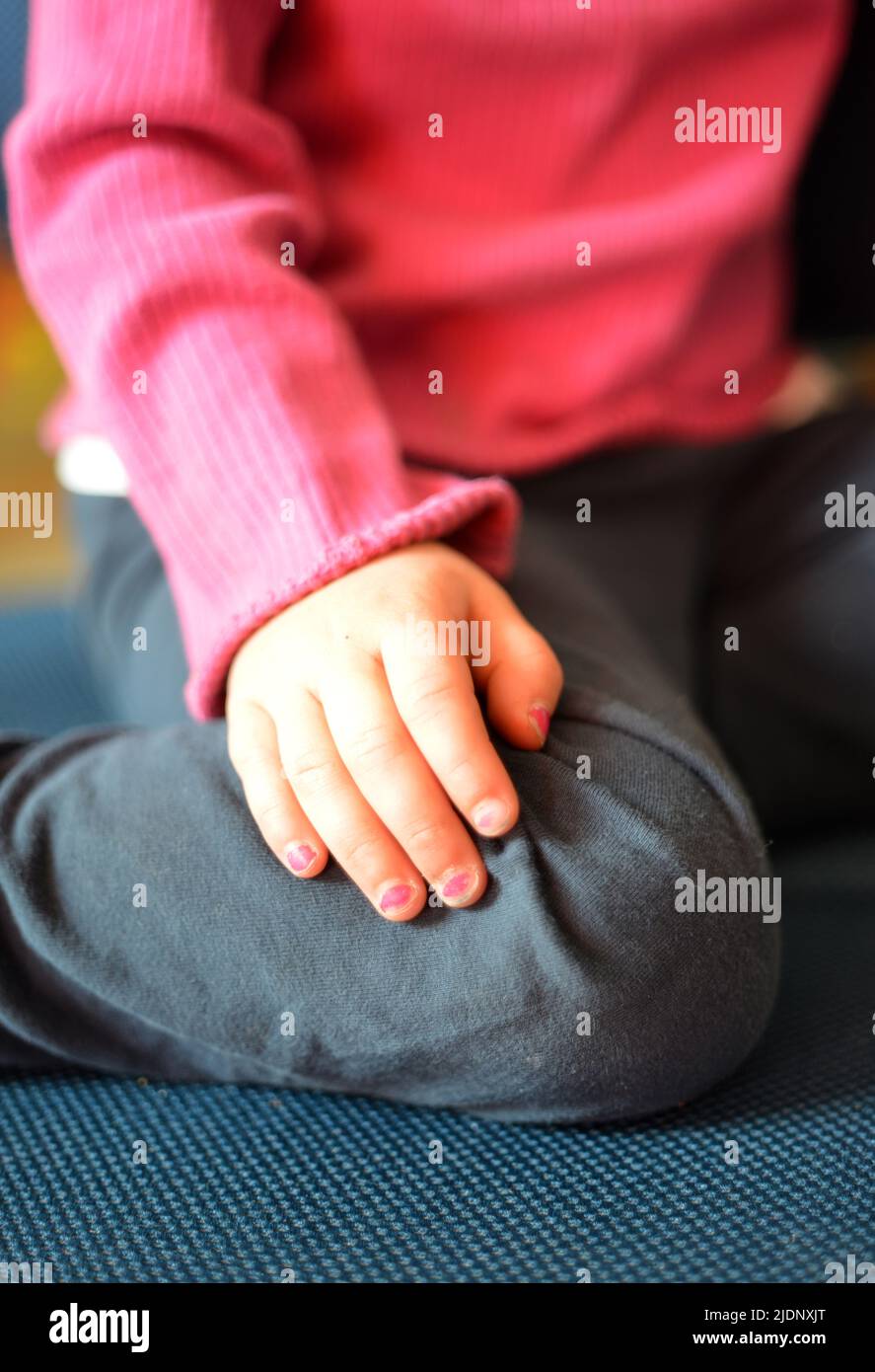 Little girls hand with pink nail color Stock Photo - Alamy