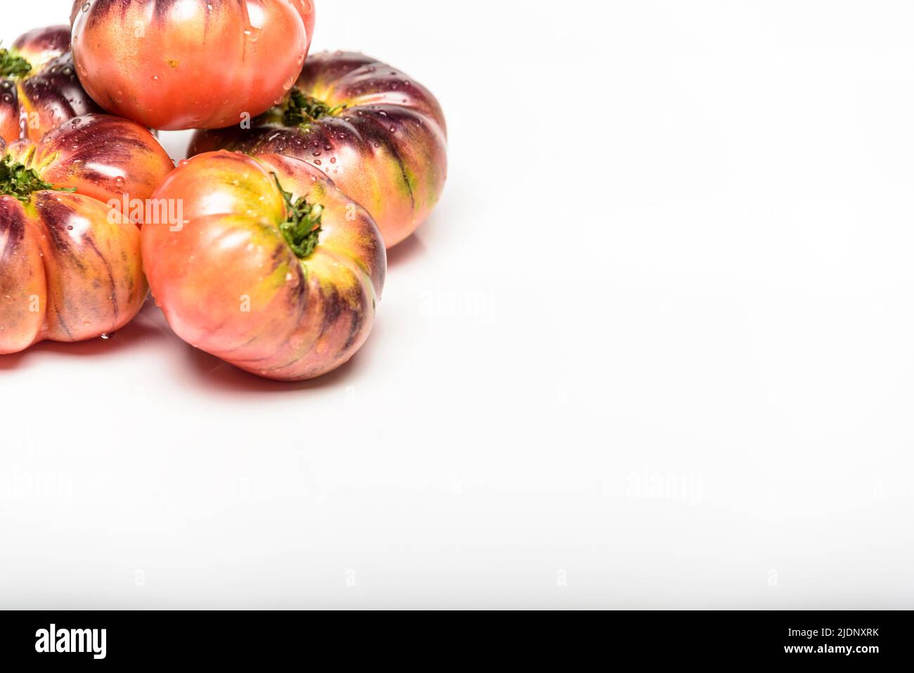 Green Tiger tomatoes isolated on white, top view Stock Photo - Alamy