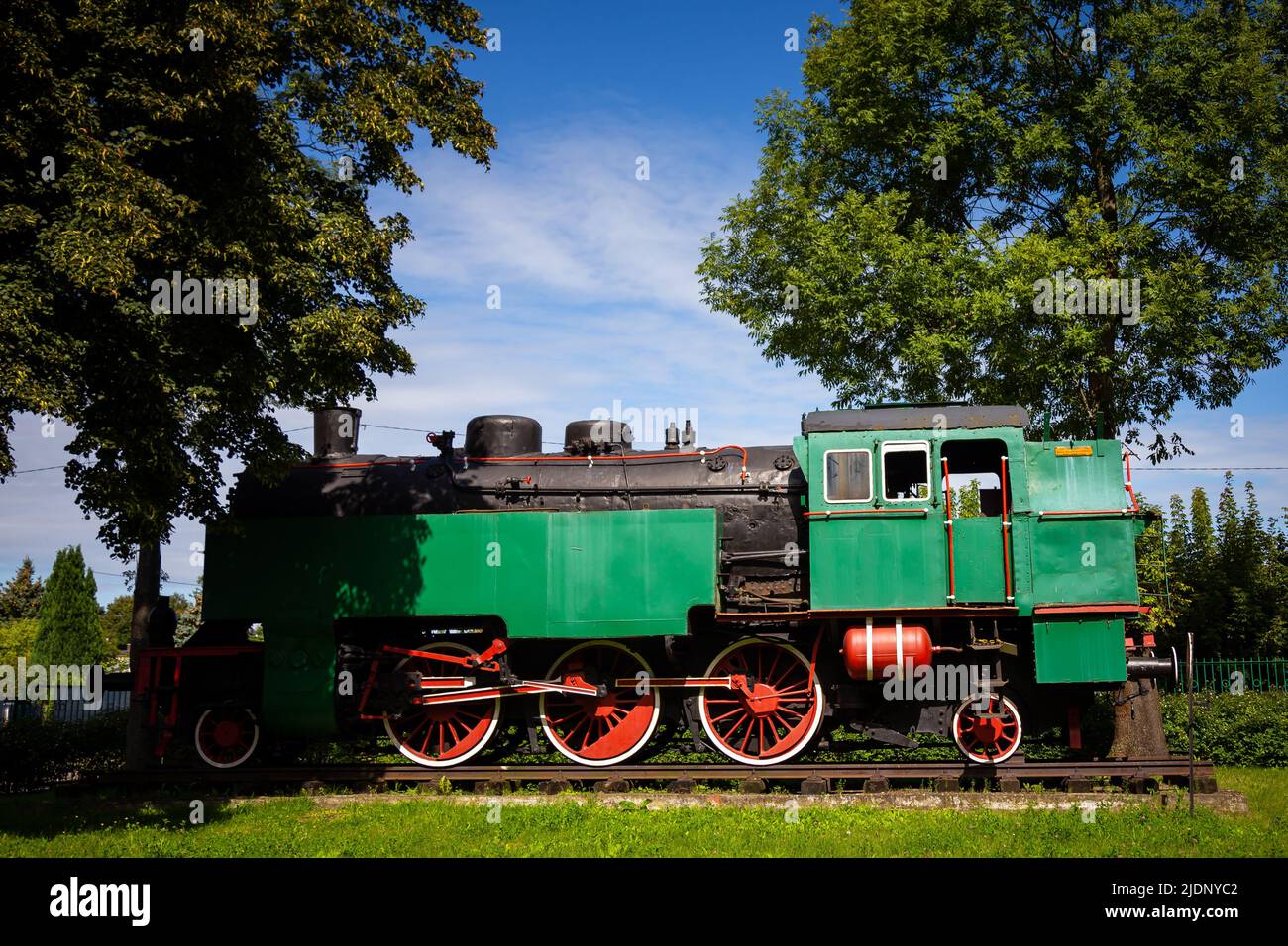 A steam locomotive standing outside of historic locomotive shed. The ...