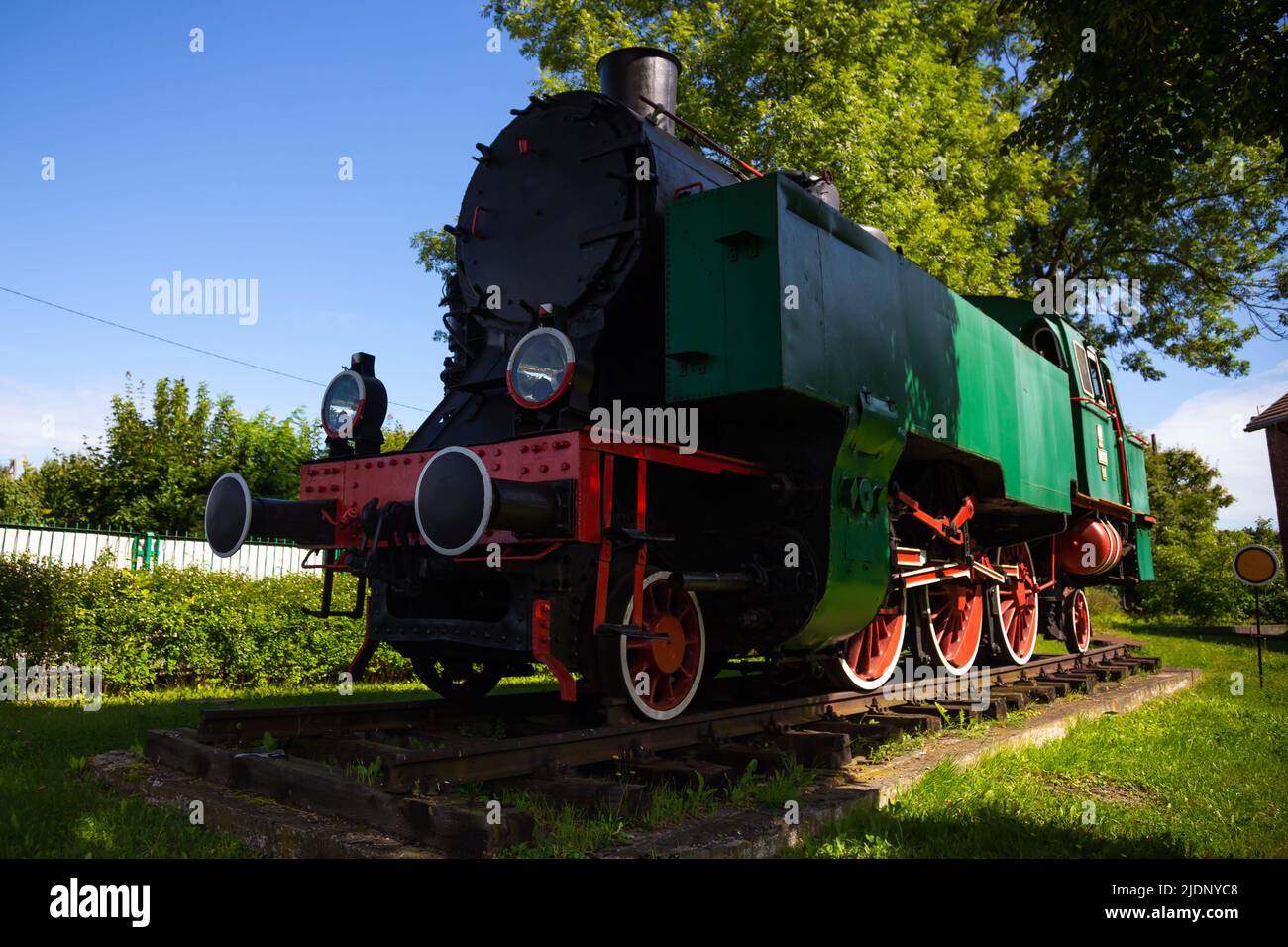 A steam locomotive standing outside of historic locomotive shed. The ...