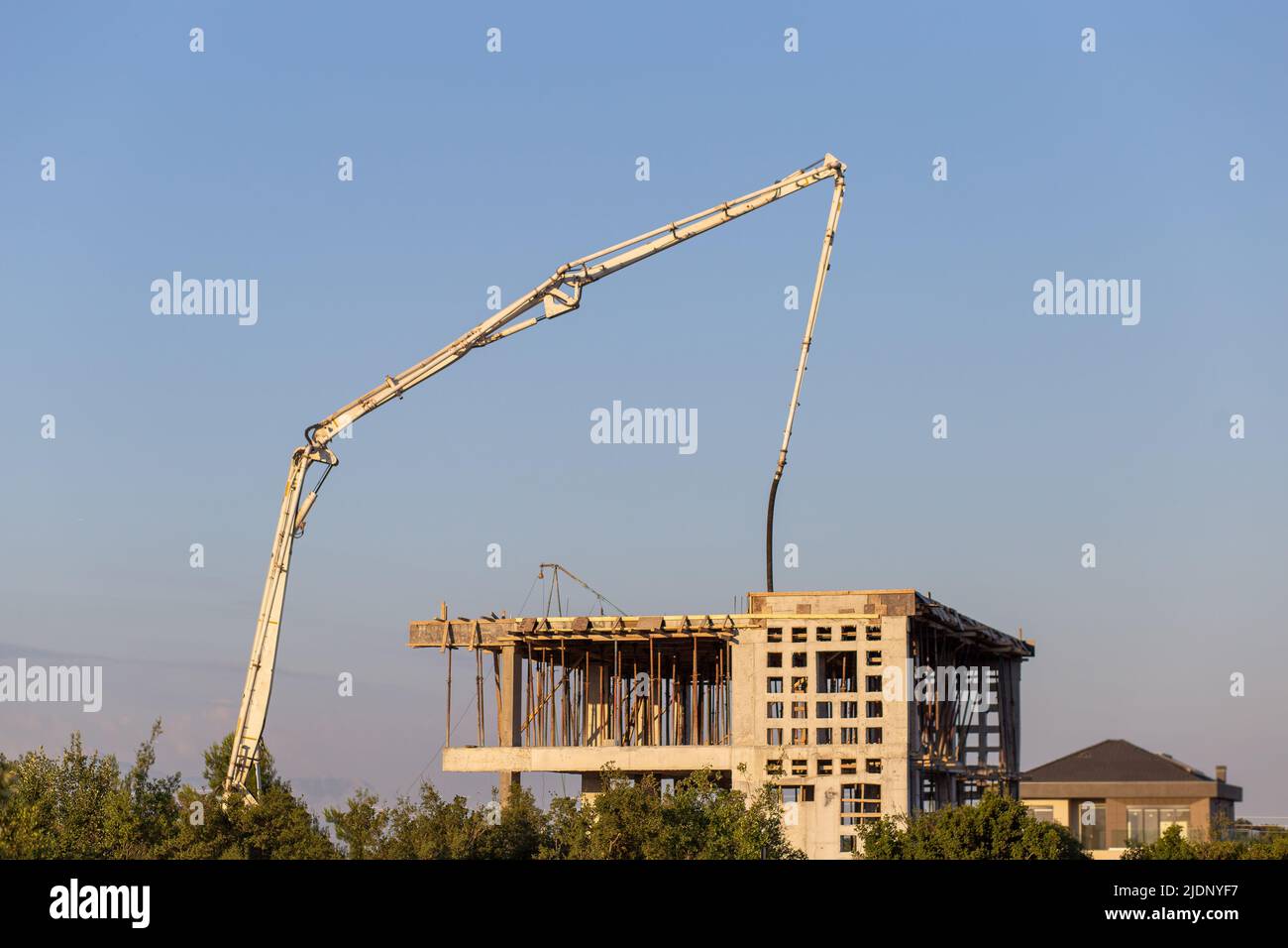 Concrete pump pouring concrete for construction Stock Photo - Alamy