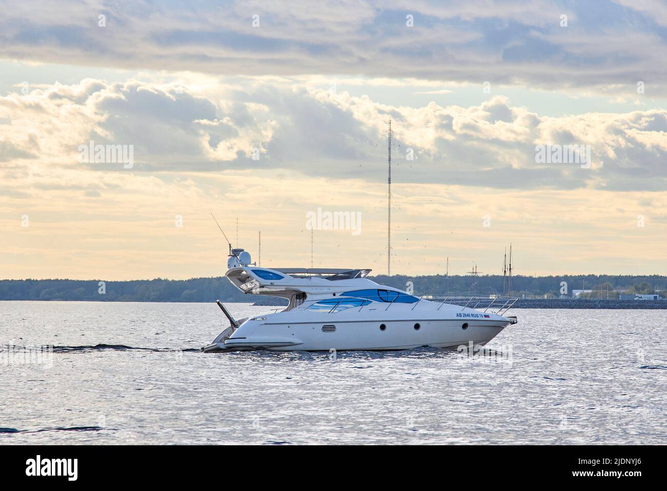 Photo of a yacht sailing in the bay Stock Photo - Alamy