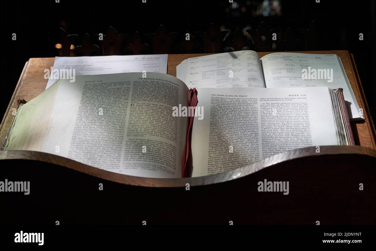 Open bible on a church lectern Stock Photo - Alamy