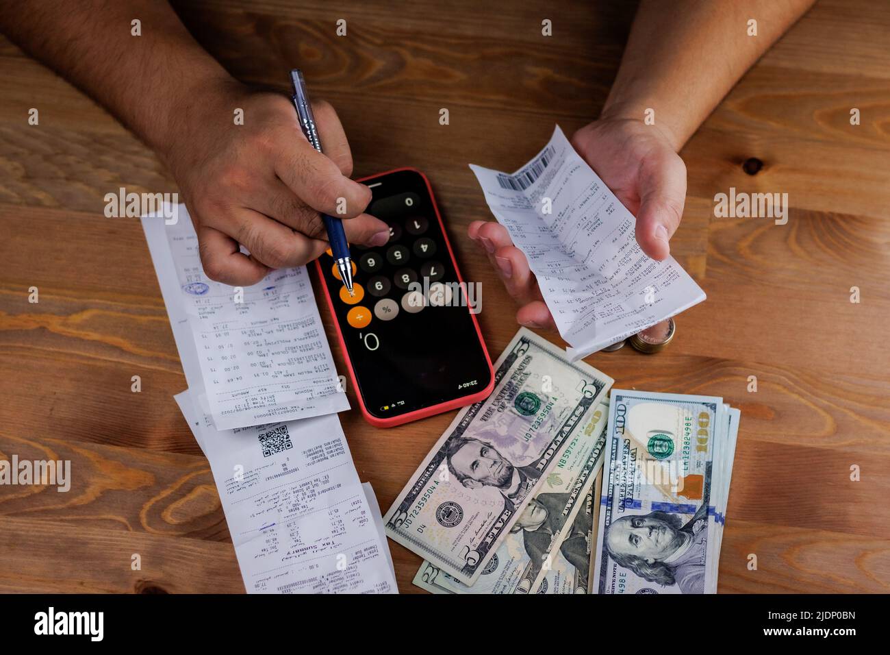checks on the table with money, a man counts his expenses on a ...
