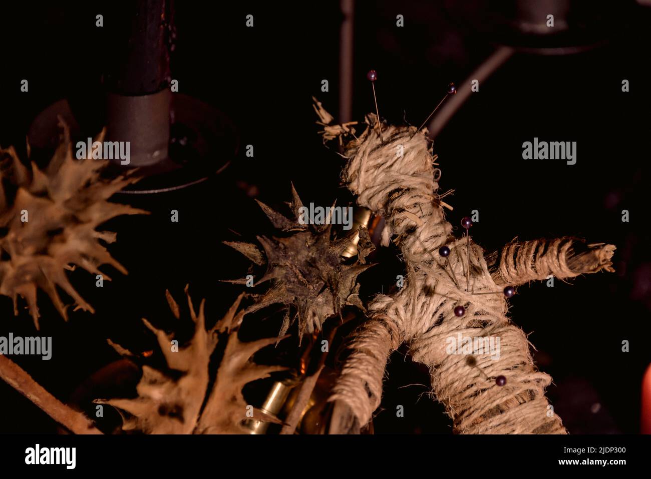 Scary voodoo doll with black candles. Mystic background with ritual ...