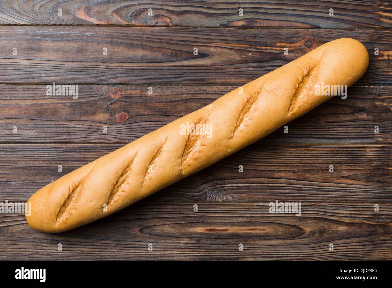 Minimalist french baguette on colored background. fresh bread as ...