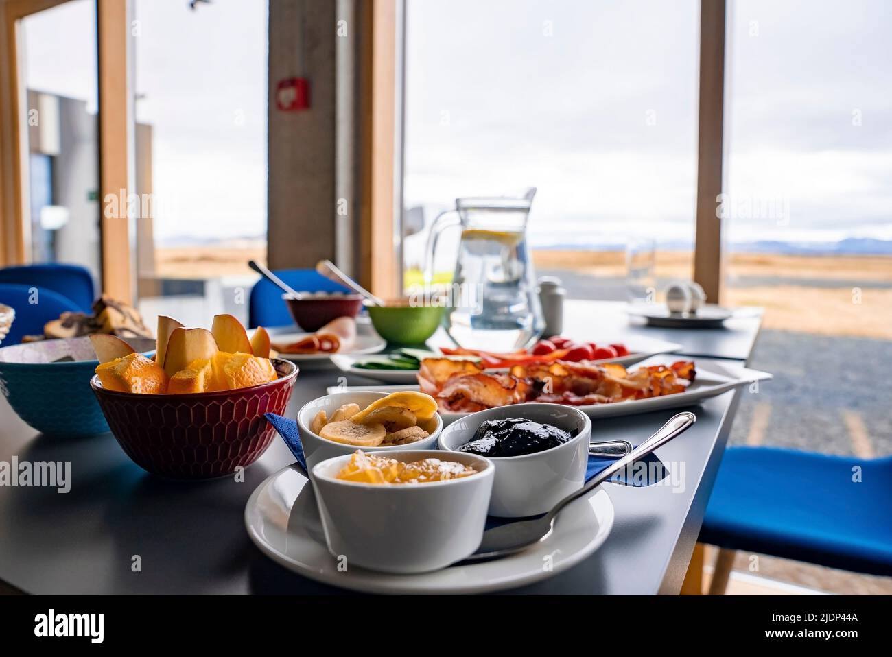 Healthy breakfast served on dining table against window with view at ...