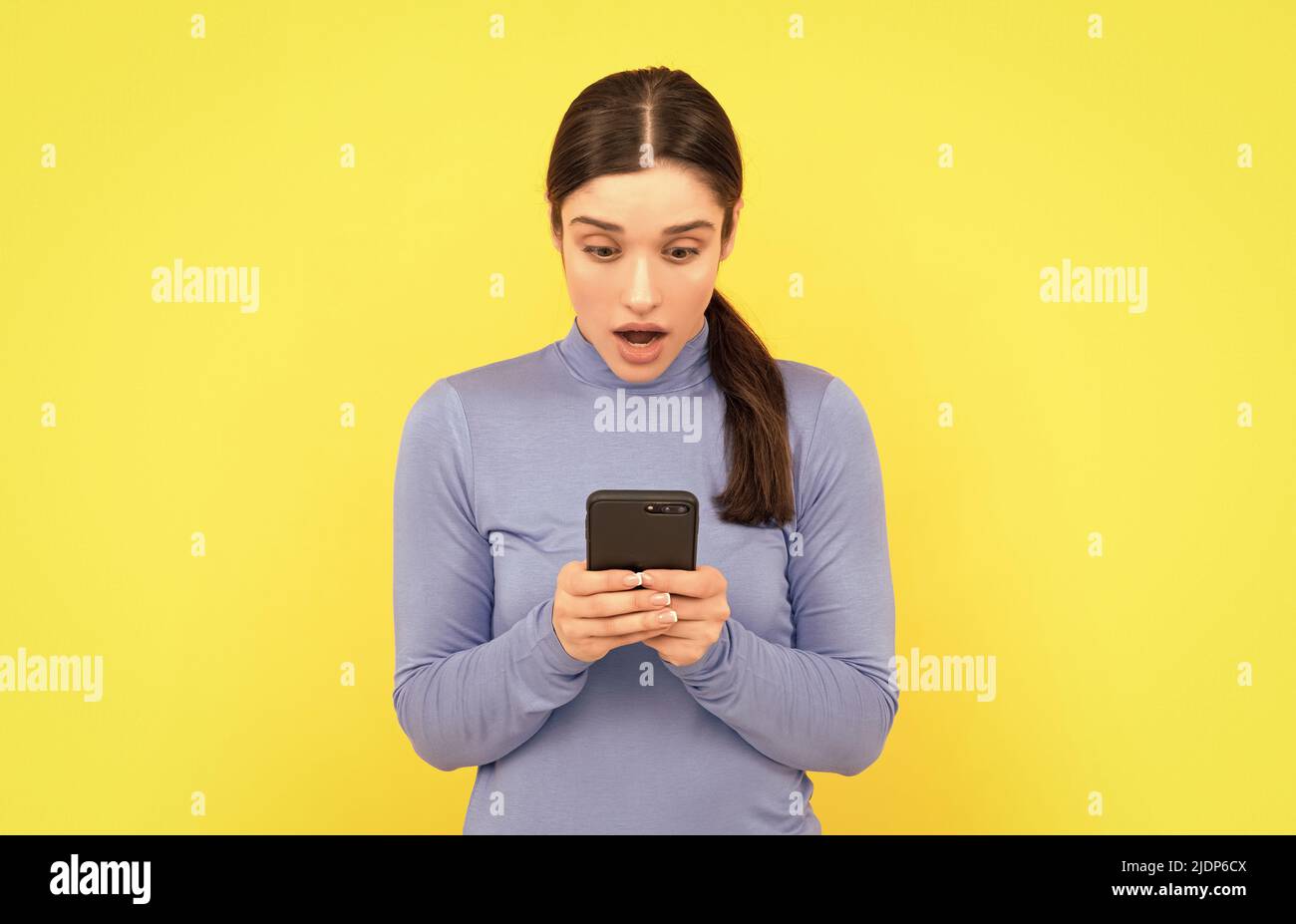 surprised woman read text message on smartphone, blogger Stock Photo ...