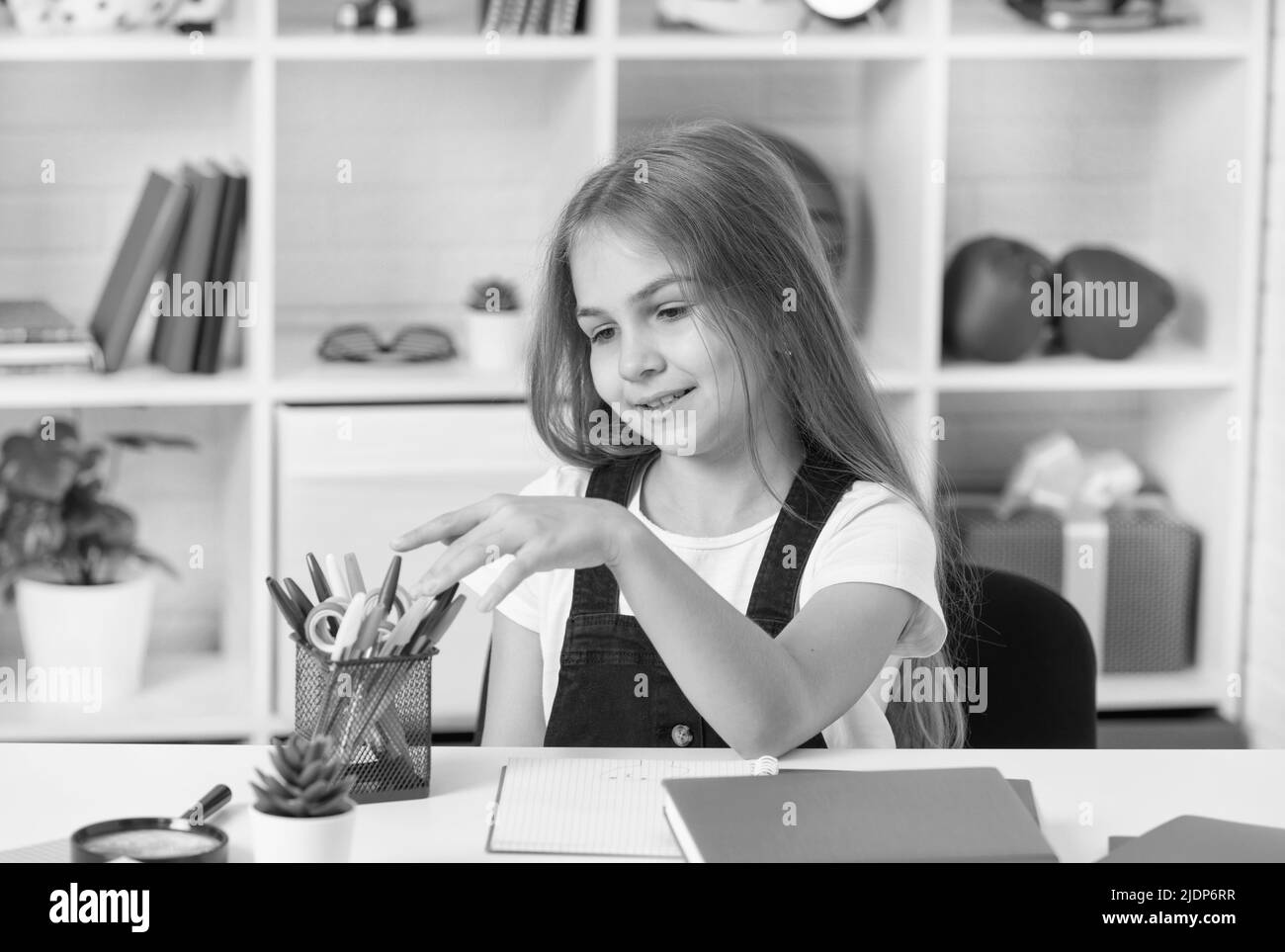cheerful kid going to do homework with book. education. high school ...