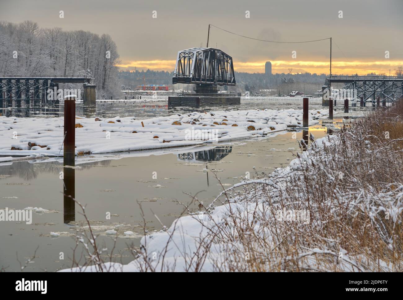 Open Rail Bridge Fraser River Winter. Ice chunks flow under a railway ...