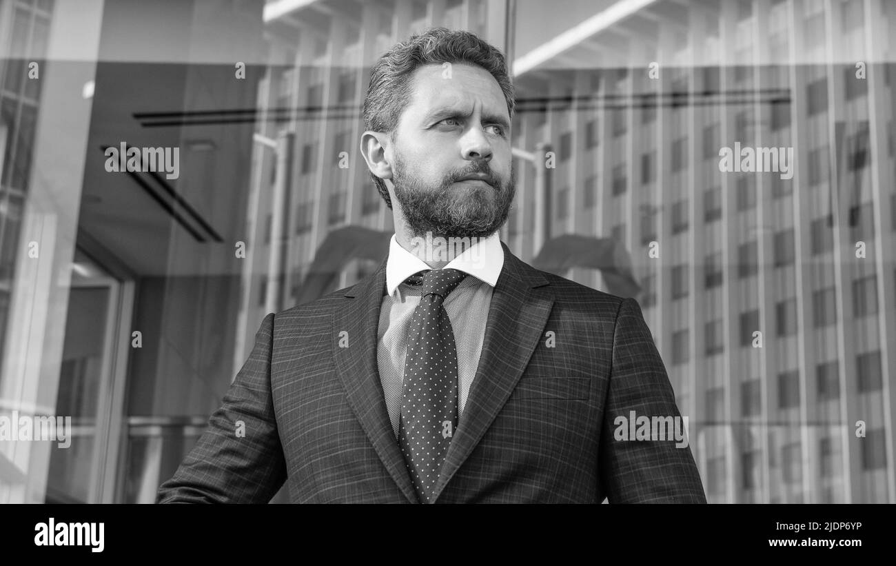 successful man in businesslike suit. manager executive outside the ...