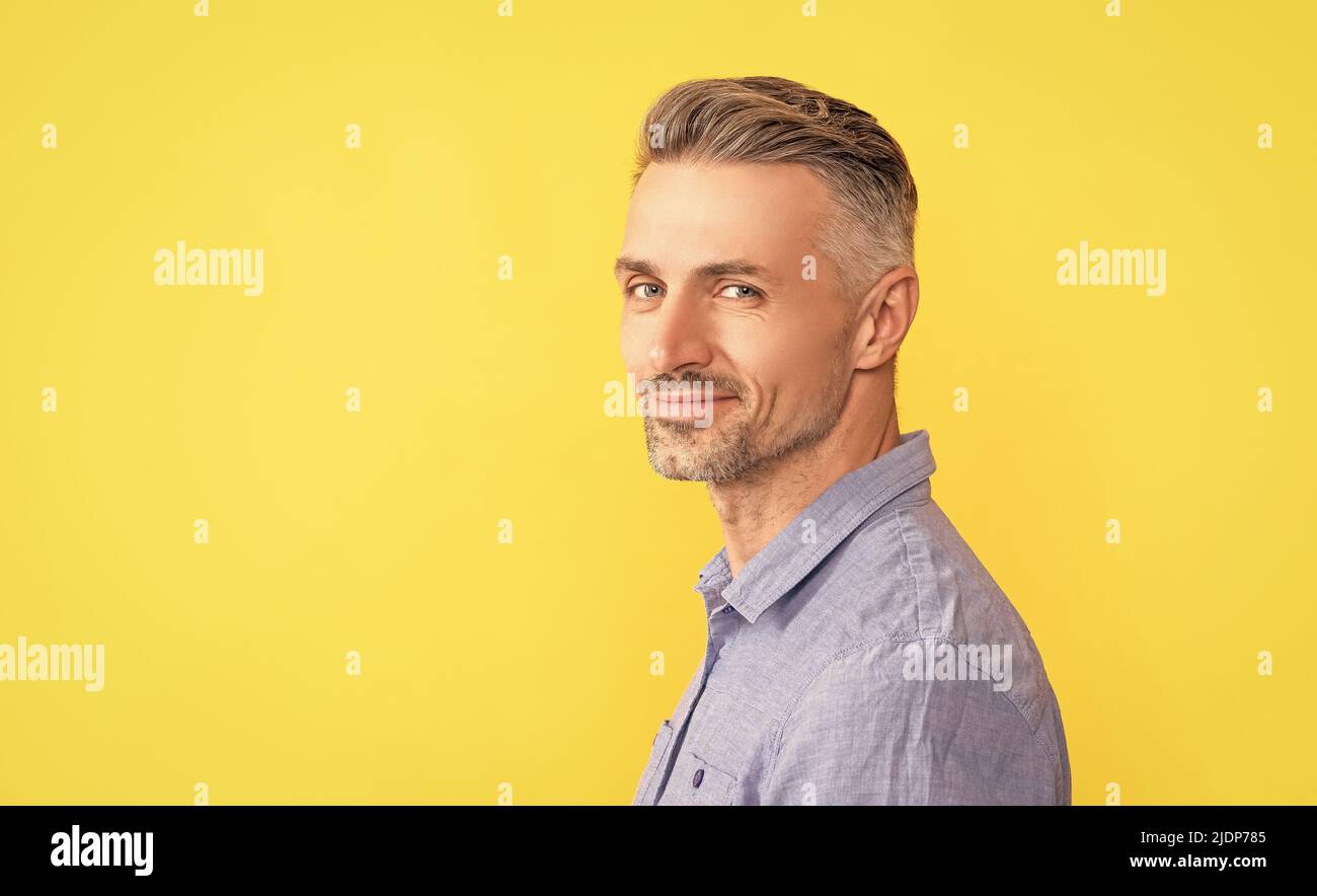smiling mature man portrait with hoary hair on yellow background, copy ... smiling mature man portrait with hoary hair on yellow background, copy ...
