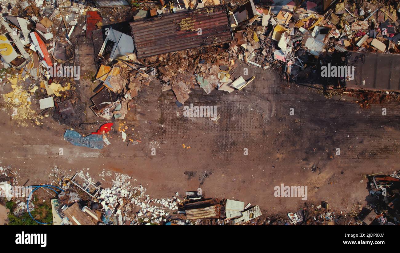 Aerial shot from above of a dirty disgusting landfill with lots of ...