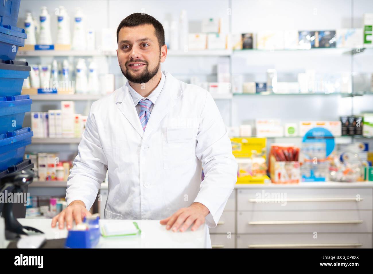 Smiling man standing counter hi-res stock photography and images - Alamy