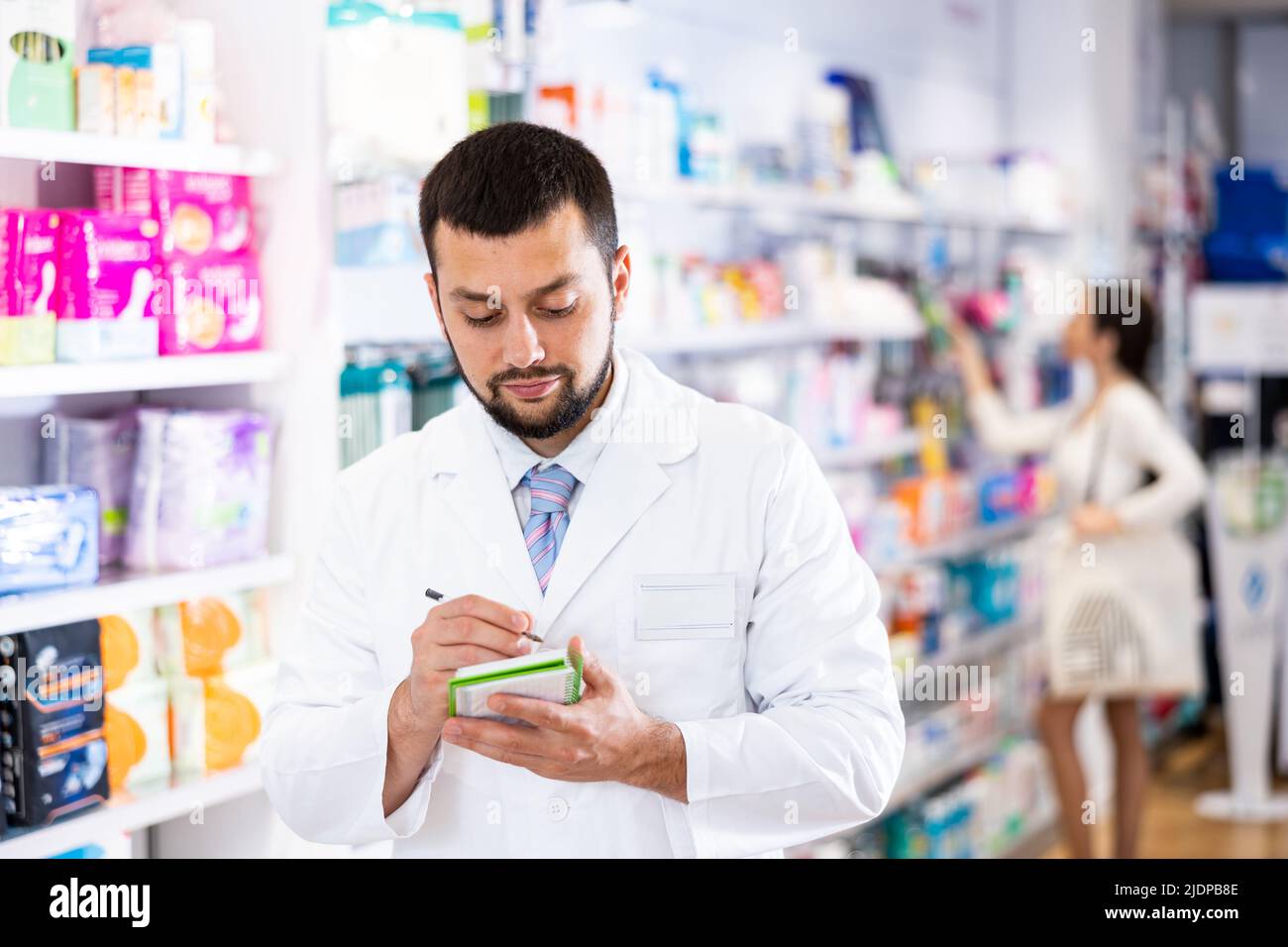 Male pharmacist checking assortment of drugs Stock Photo - Alamy