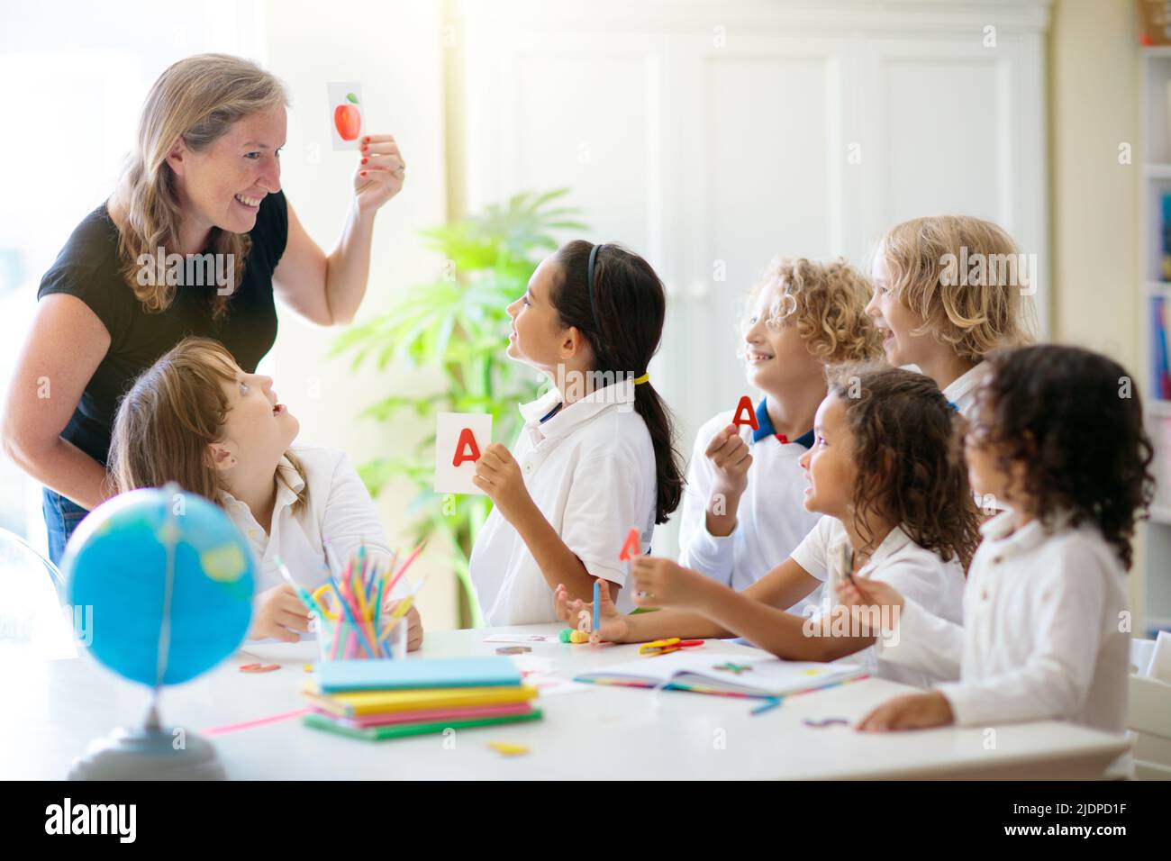 Kids go back to school. Interracial group of children of mixed age in ...