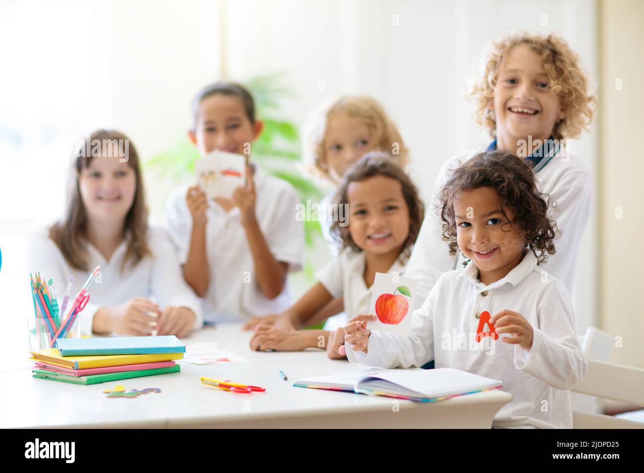 Kids go back to school. Interracial group of children of mixed age in ...