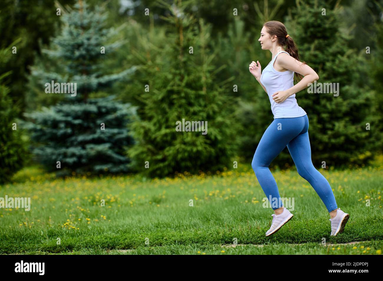 Young woman athlete runs on hi-res stock photography and images - Alamy