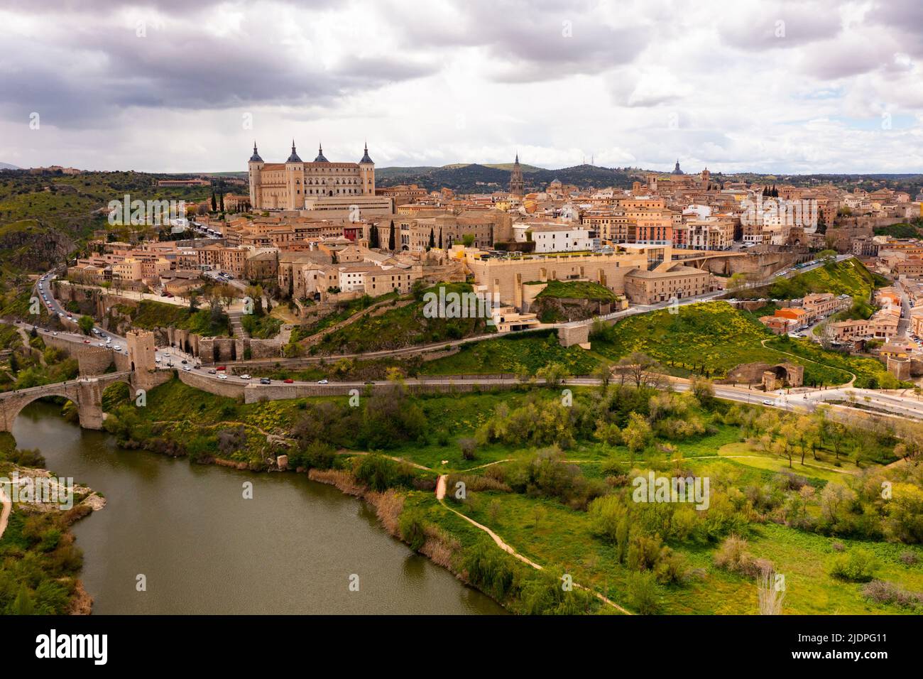 Aerial view of Toledo cityscape on Tagus river with Alcazar castle ...