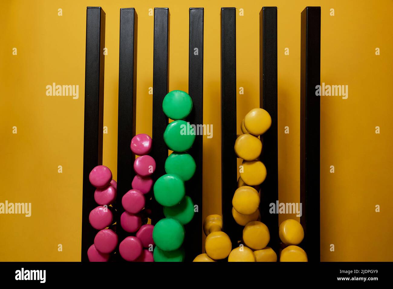 dumbbell, barbell. Background of many color weights Stock Photo - Alamy