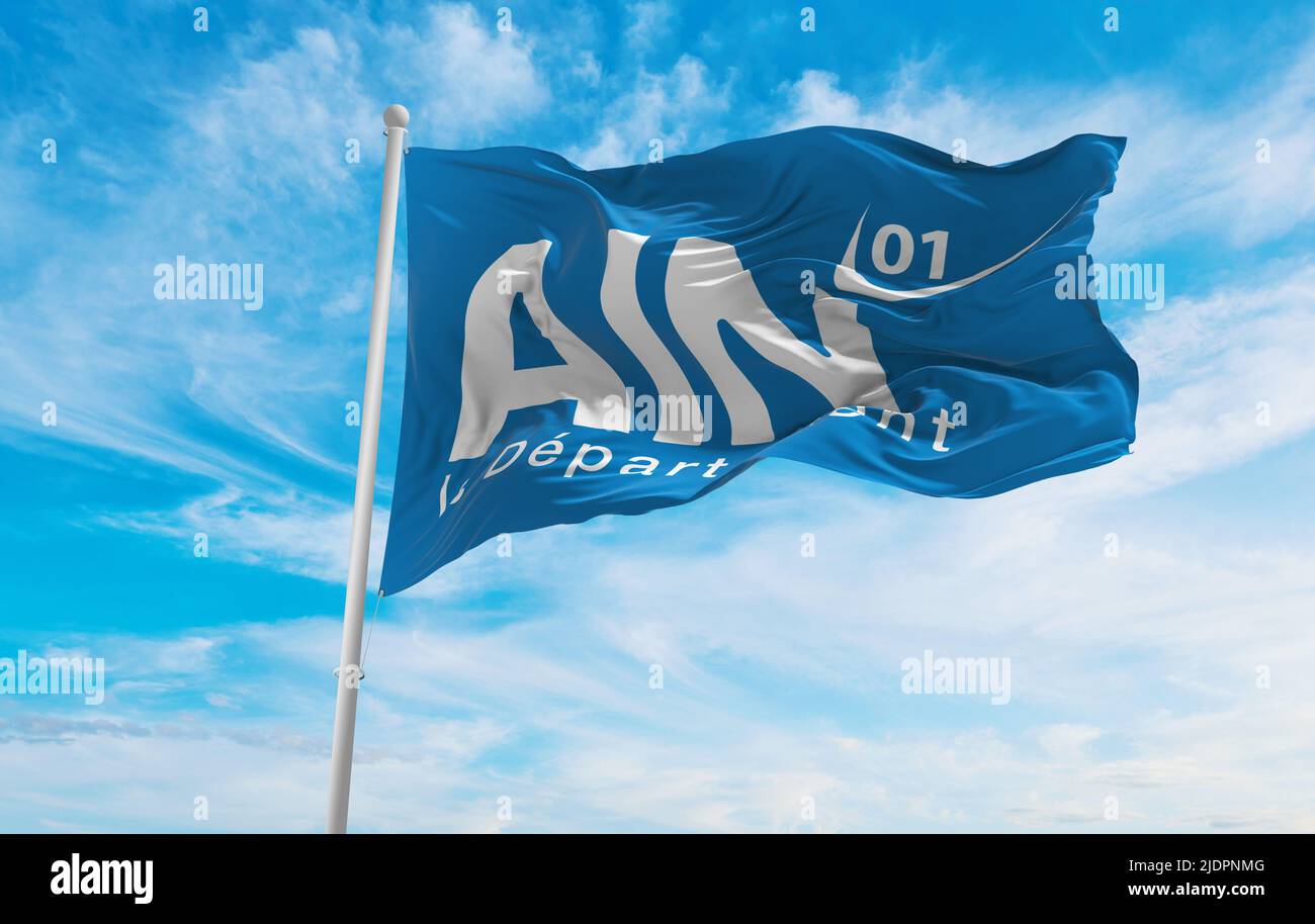 flag of department of Ain, France at cloudy sky background on sunset ...