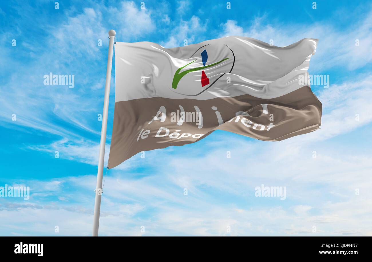 flag of department of Allier, France at cloudy sky background on sunset ...