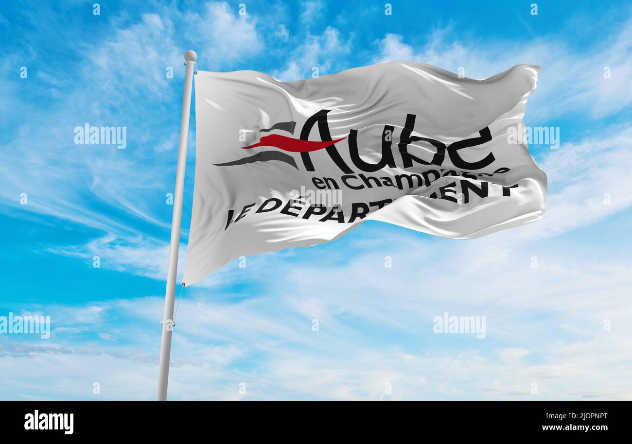 flag of department of Aube, France at cloudy sky background on sunset ...