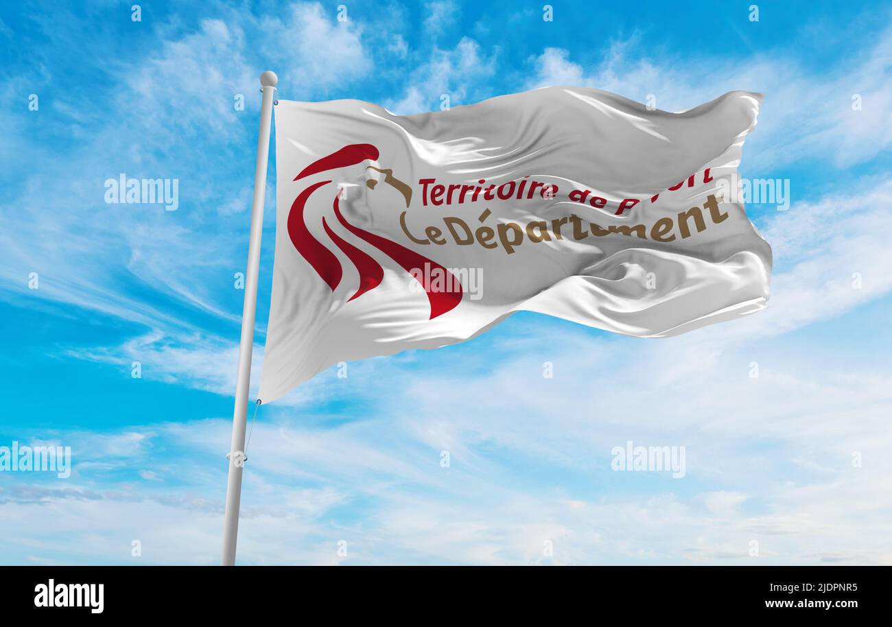 flag of department of Belfort, France at cloudy sky background on ...