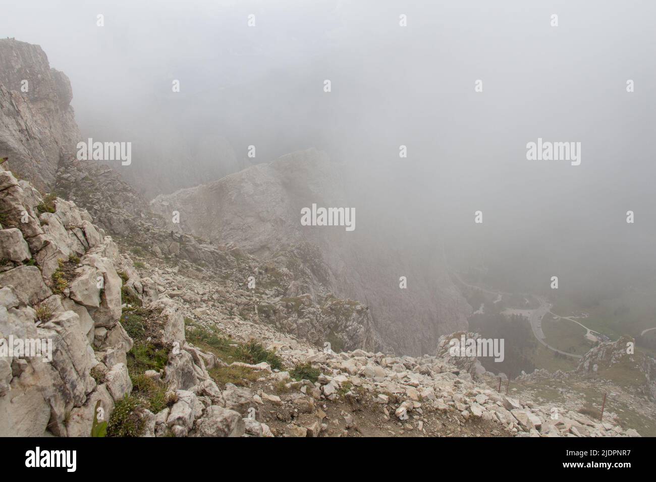 The view of mountain massif through dense fog, Lagazuoi, Italian Alps ...