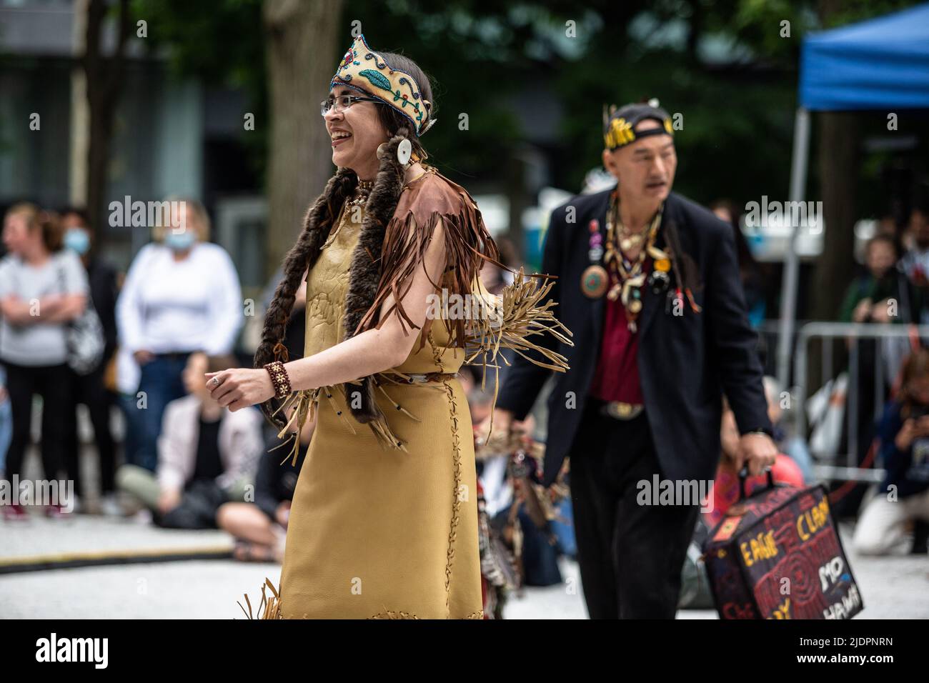 An Indigenous dancer in traditional dress takes part during the concert ...